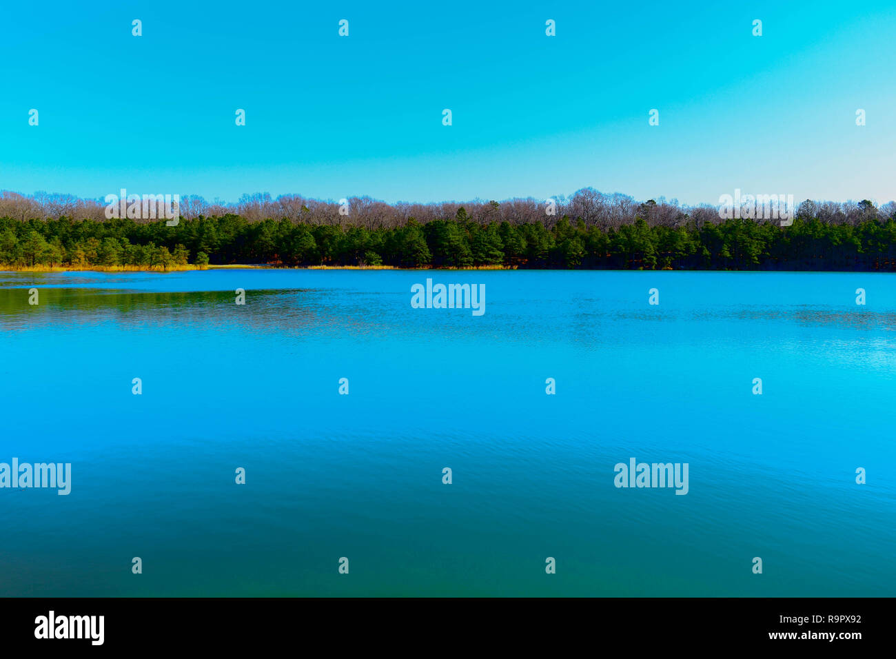 Blue lake with peninsula Stock Photo - Alamy