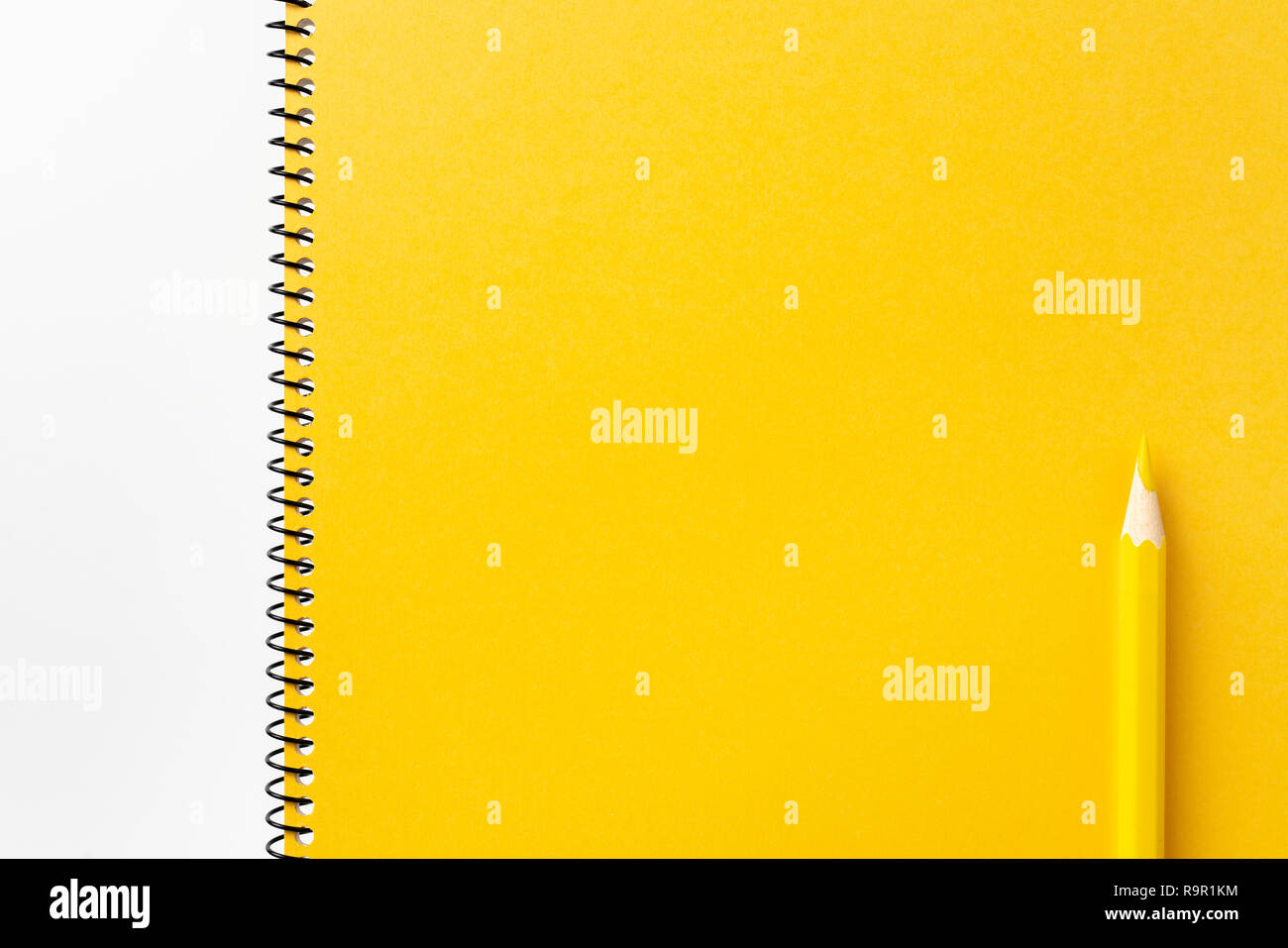 Design concept - Top view of yellow spiral notebook with geometric ...