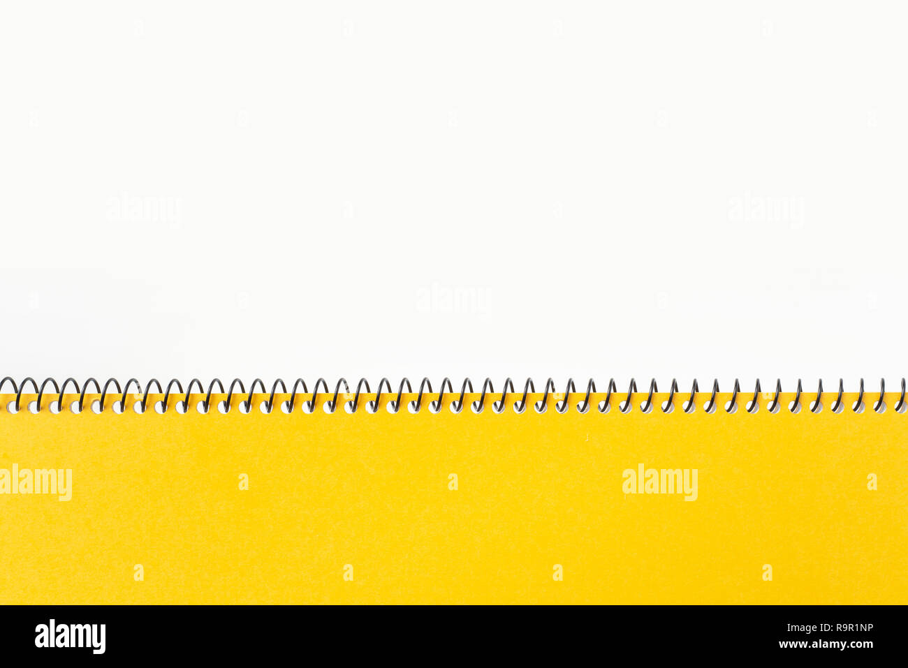 Design concept - Top view of yellow spiral notebook with geometric ...