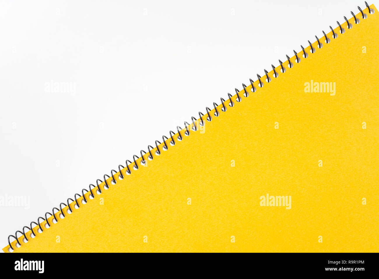 Design concept - Top view of yellow spiral notebook with geometric ...
