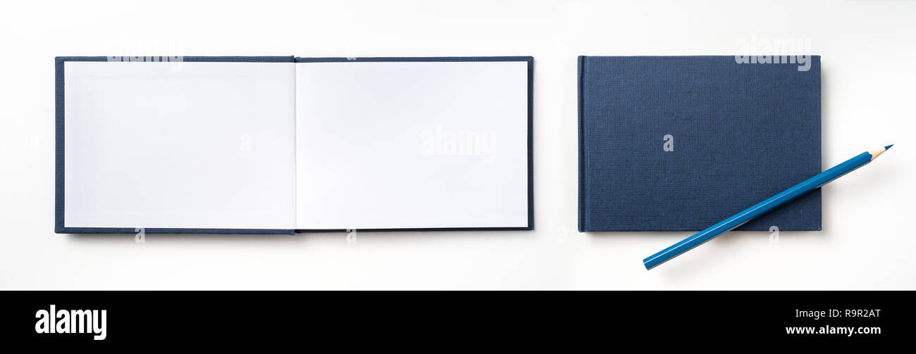 Design concept - Top view of blue hardcover notebook and pencil ...