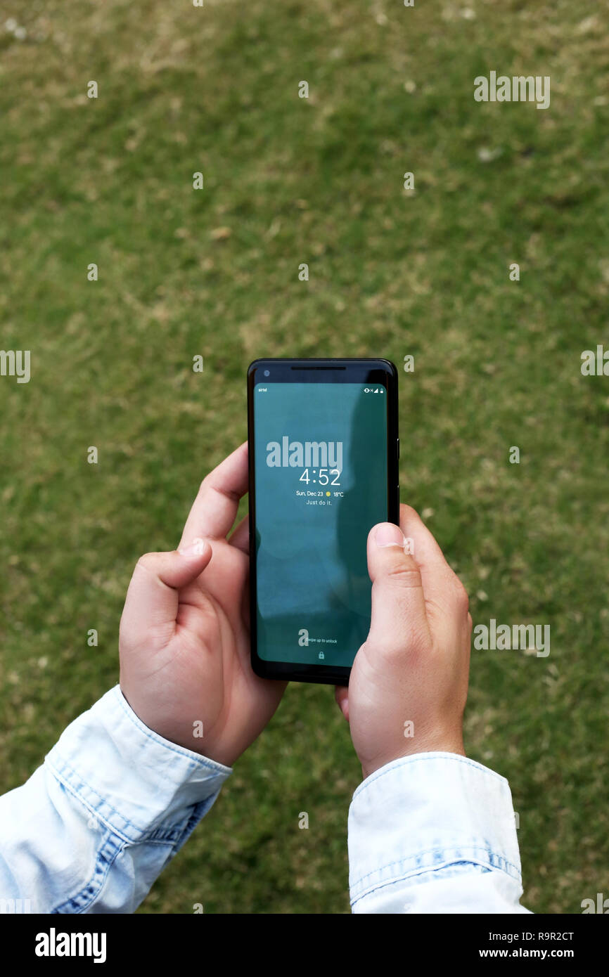 Man is looking time in phone Stock Photo - Alamy