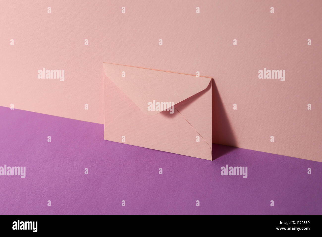 envelope. Pink Two Tone Background Stock Photo - Alamy