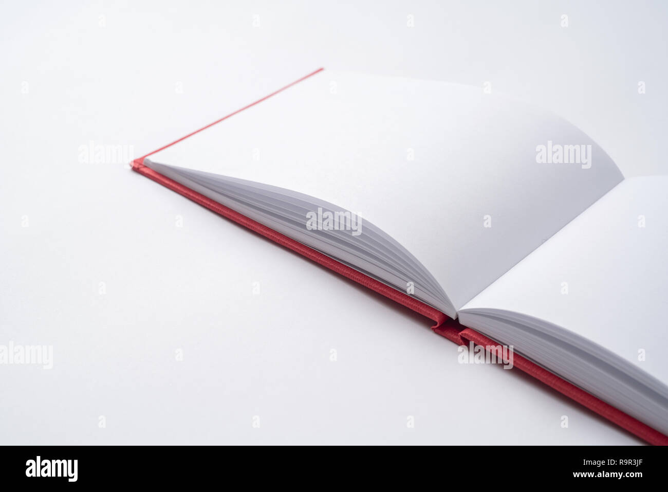 Design concept - Perspective view red hardcover notebook with open ...