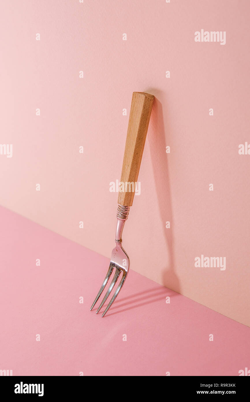a fork. Pink Two Tone Background Stock Photo - Alamy