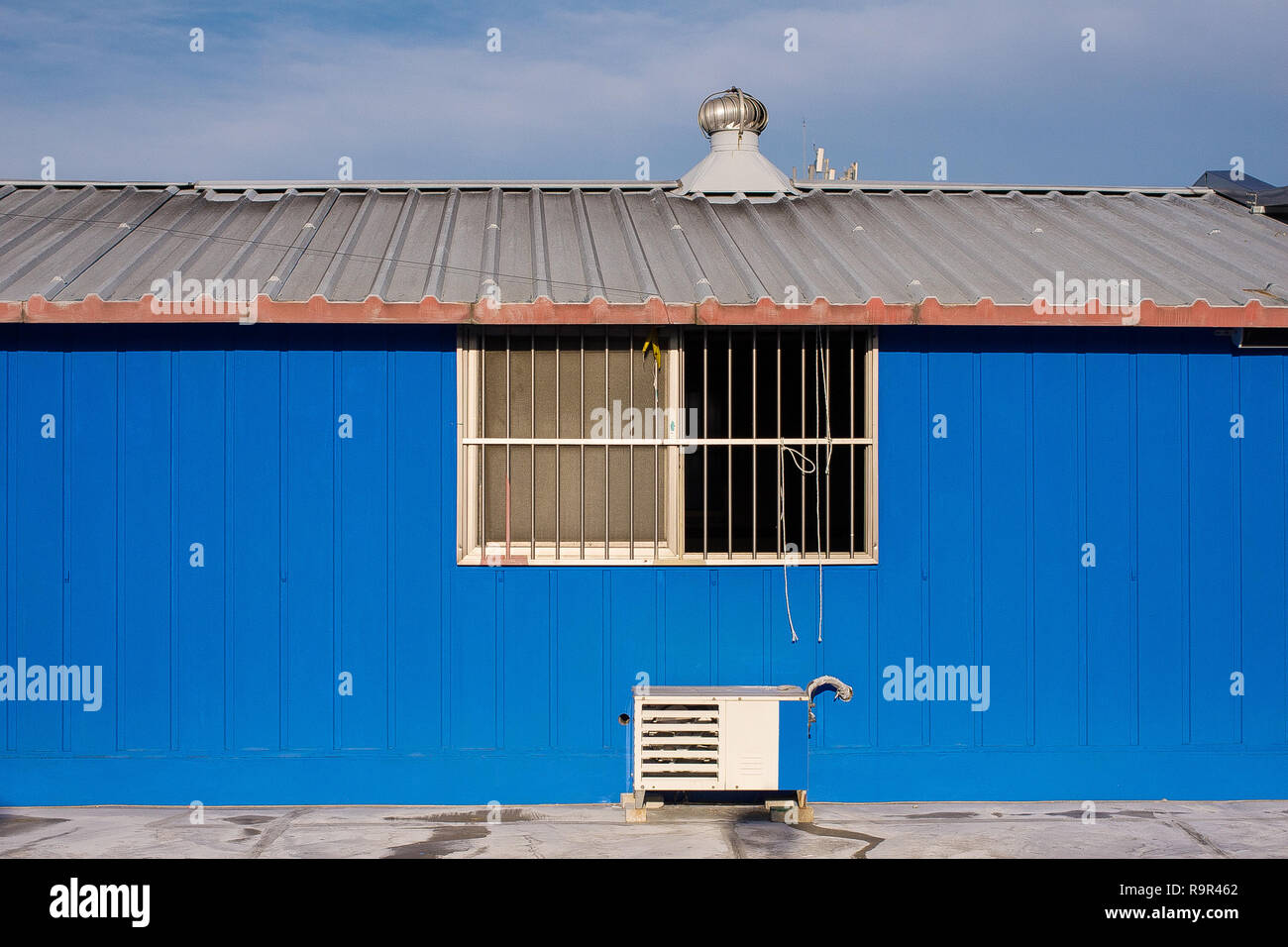 a blue house made of containers And window Stock Photo - Alamy