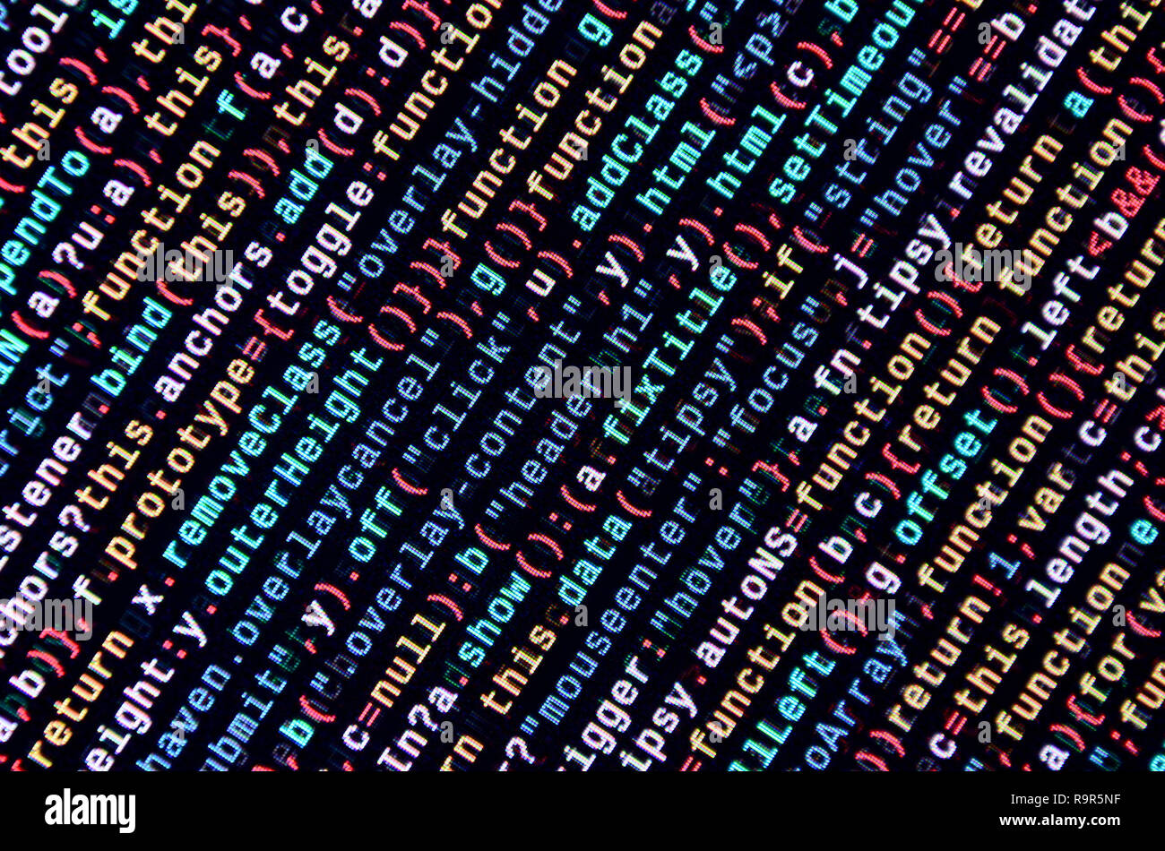 Writing programming code on laptop. Digital binary data on computer ...