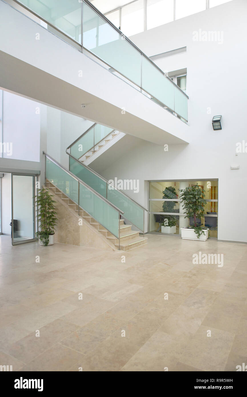 Modern building interior with staircase and walkway. Architecture and ...