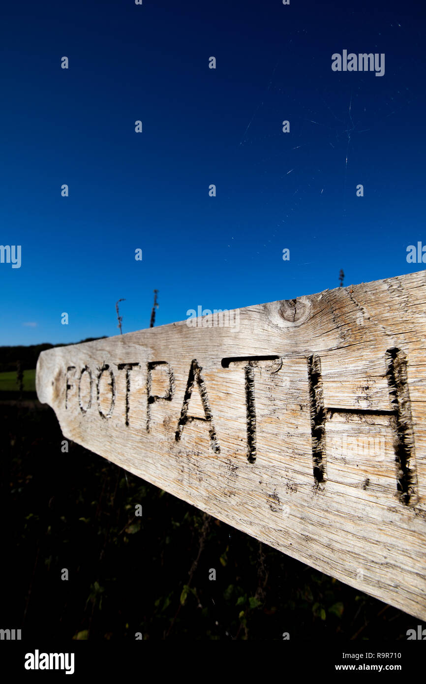 Wooden footpath sign showing right of pedestrian way across farmland in ...