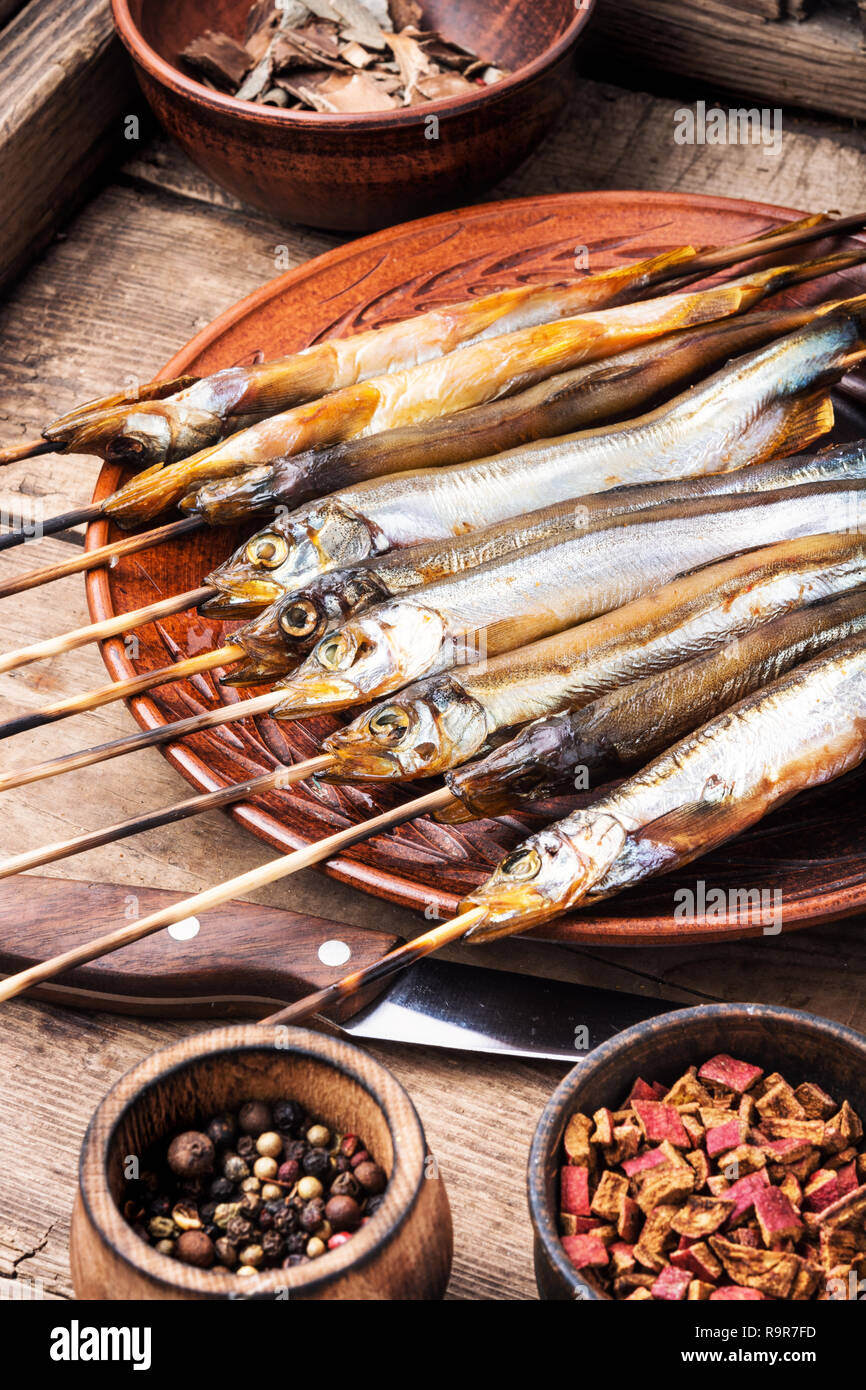Smoked fish with spices.Cold smoked fish.Smoked capelin Stock Photo - Alamy
