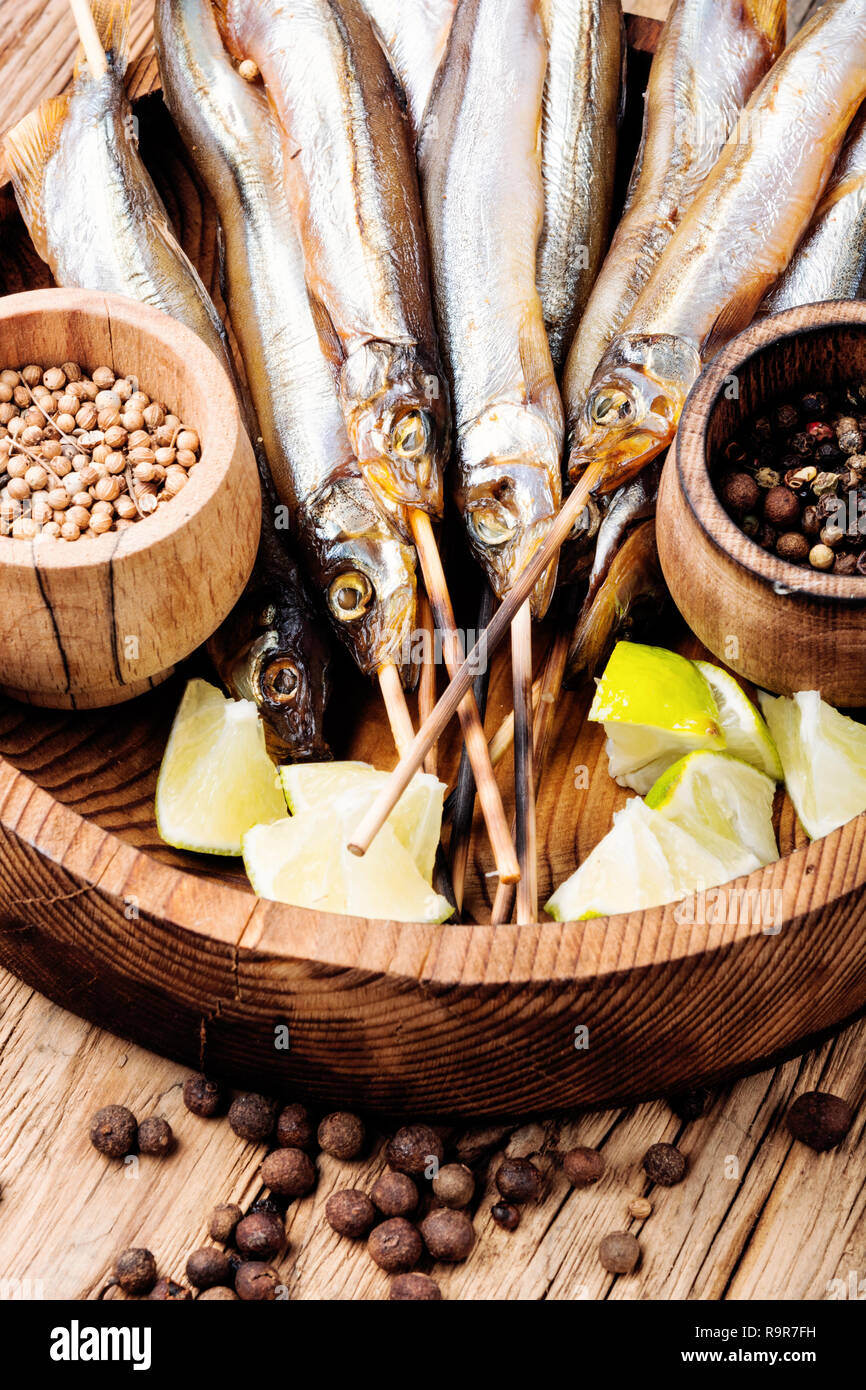 Smoked fish with spices.Cold smoked fish.Smoked capelin Stock Photo - Alamy