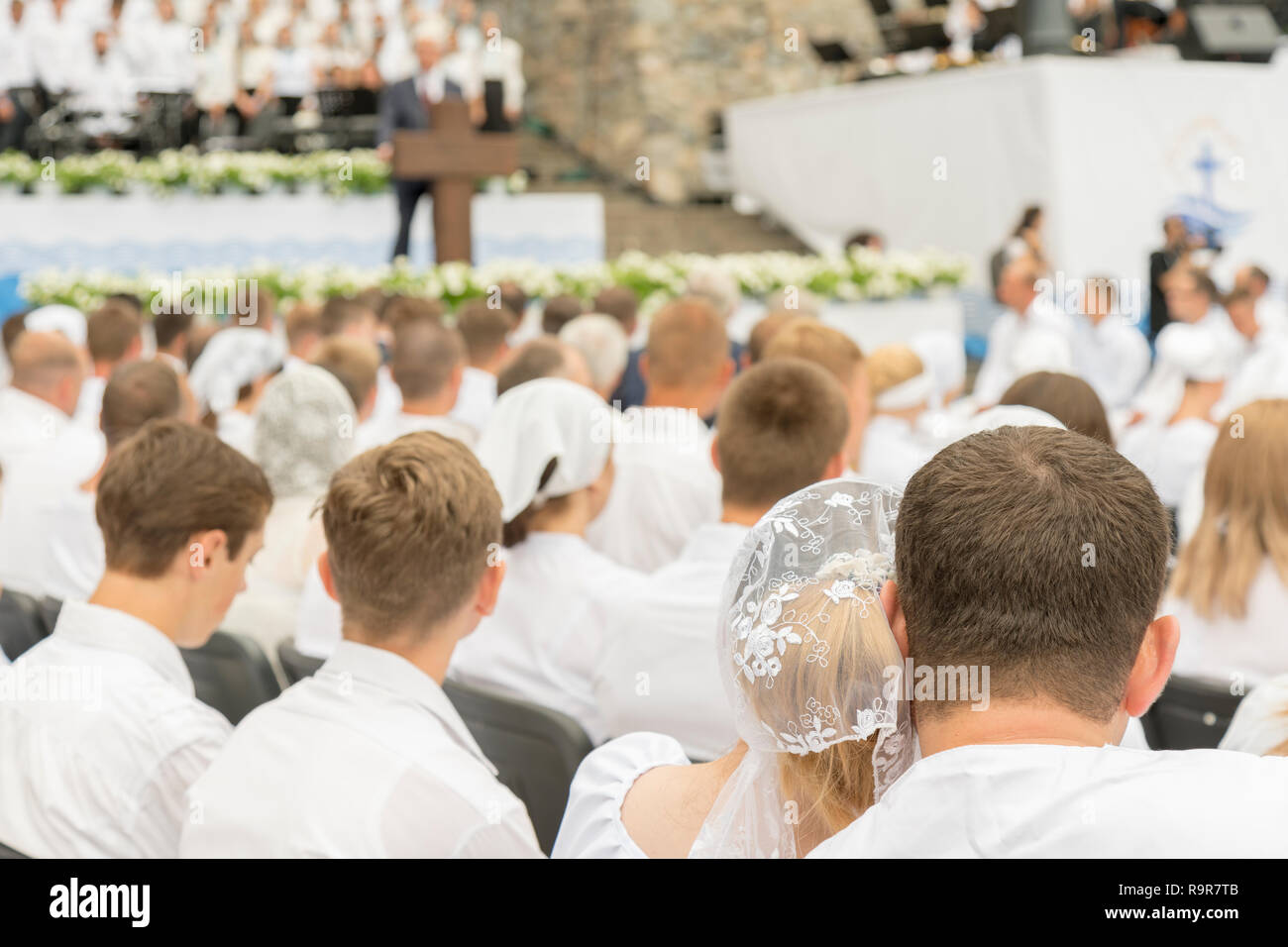 Many men and women pray to Jesus. Christian choir of young men and ...