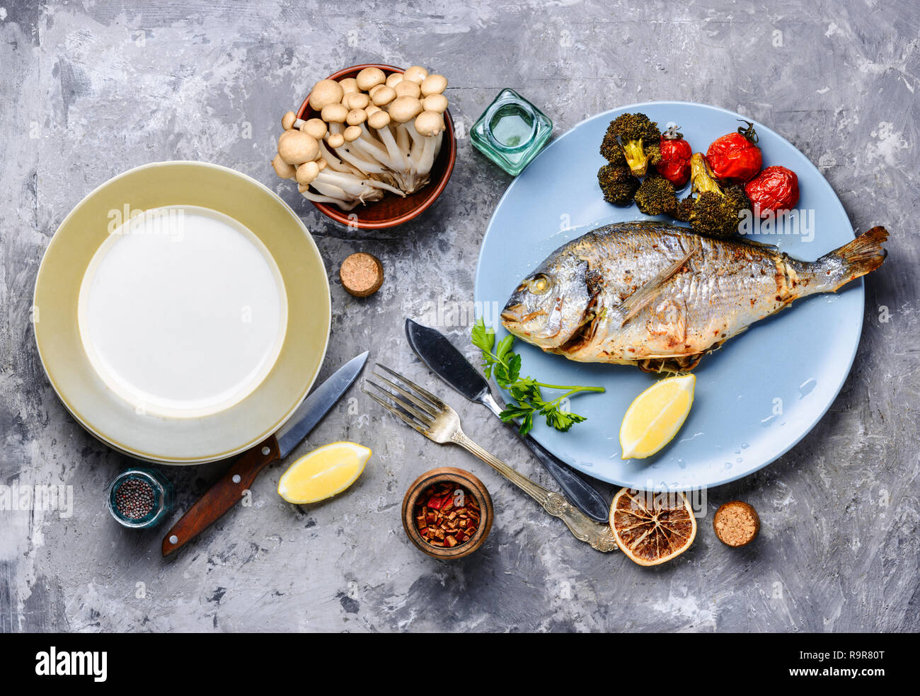 Baked fish dorado with vegetables.Sea bream or dorada fish Stock Photo ...