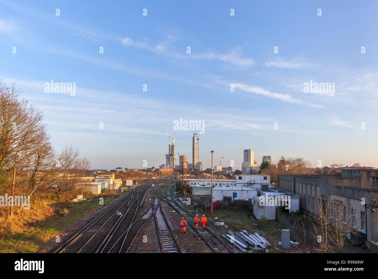 The changing skyline of Woking, Surrey: railway tracks lead into tower ...