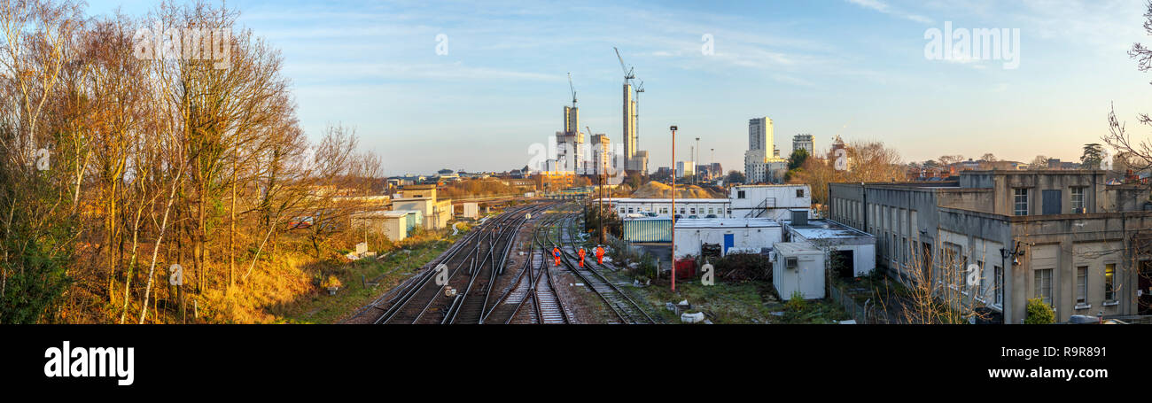 The changing skyline of Woking, Surrey: railway tracks lead into tower ...