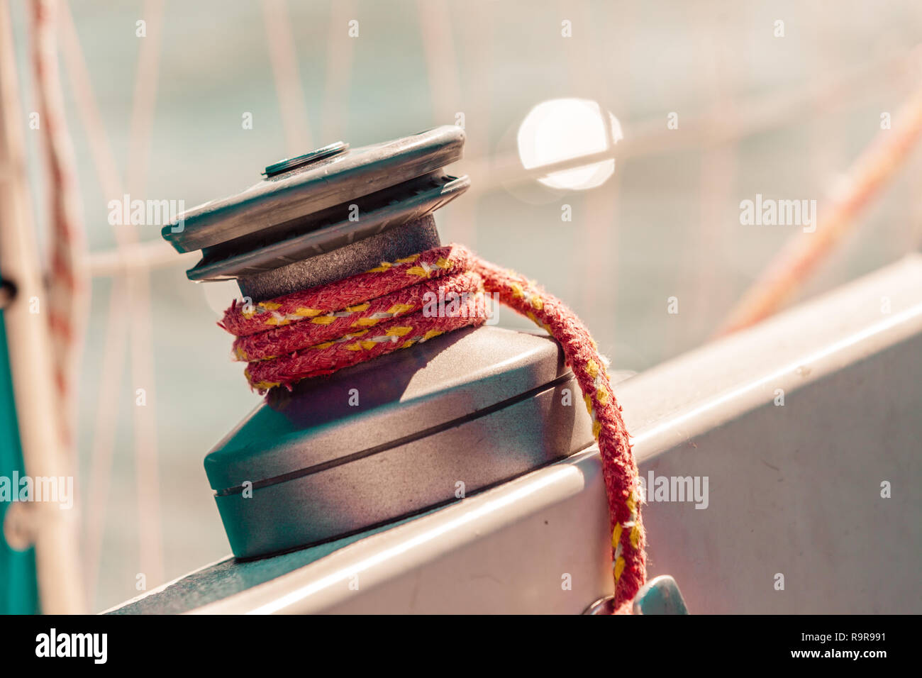 Yacht capstan with rope on sailing boat during cruise, marine objects ...
