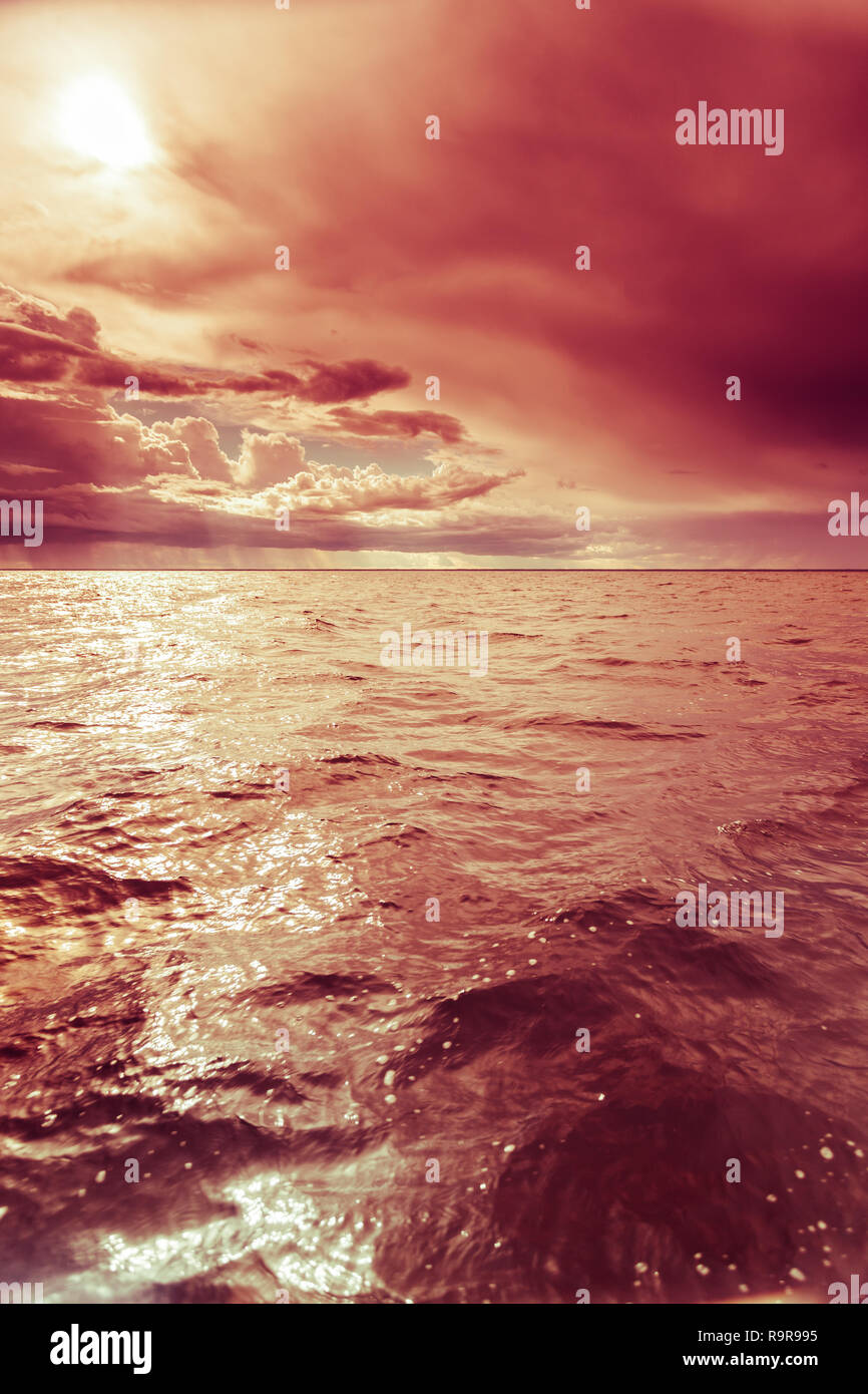 Colorful sunset over evening sea horizon, clouds sky. Tranquil scene ...