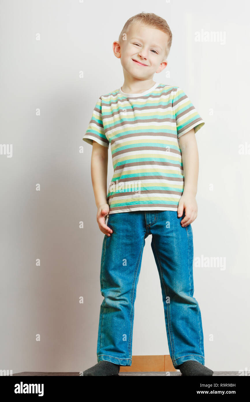 Face expressions, children fashion concept. Portrait of happy kid boy ...