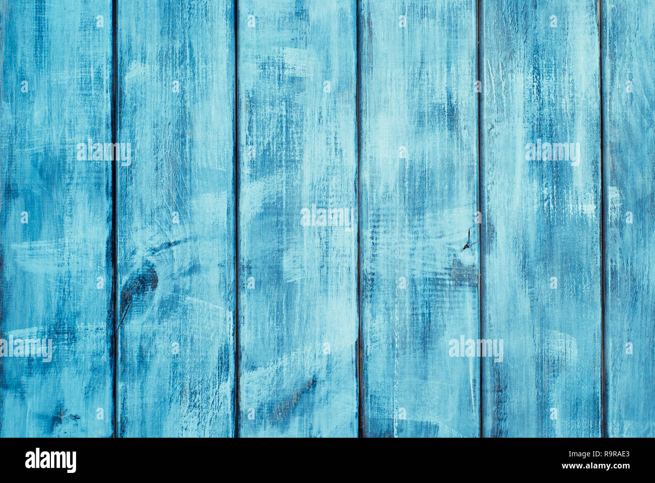 Wooden blue vertical boards. Front view with copy space. Background for ...