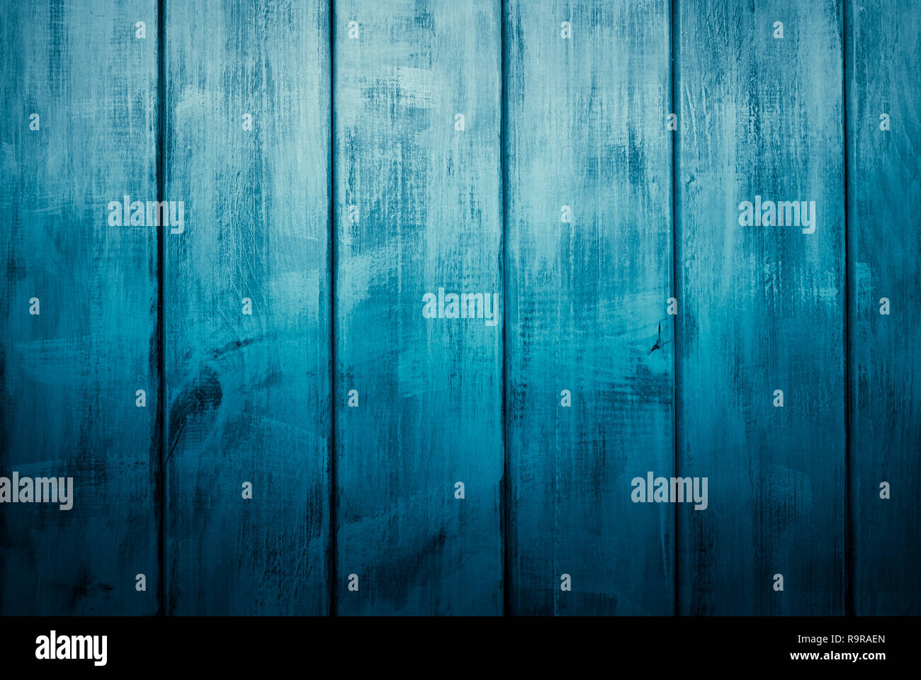 Wooden blue vertical boards. Front view with copy space. Background for ...