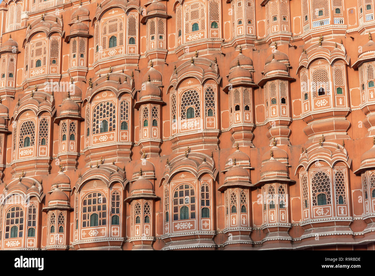 The red and pink sandstone Hawa Mahal Palace facade in Jaipur ...