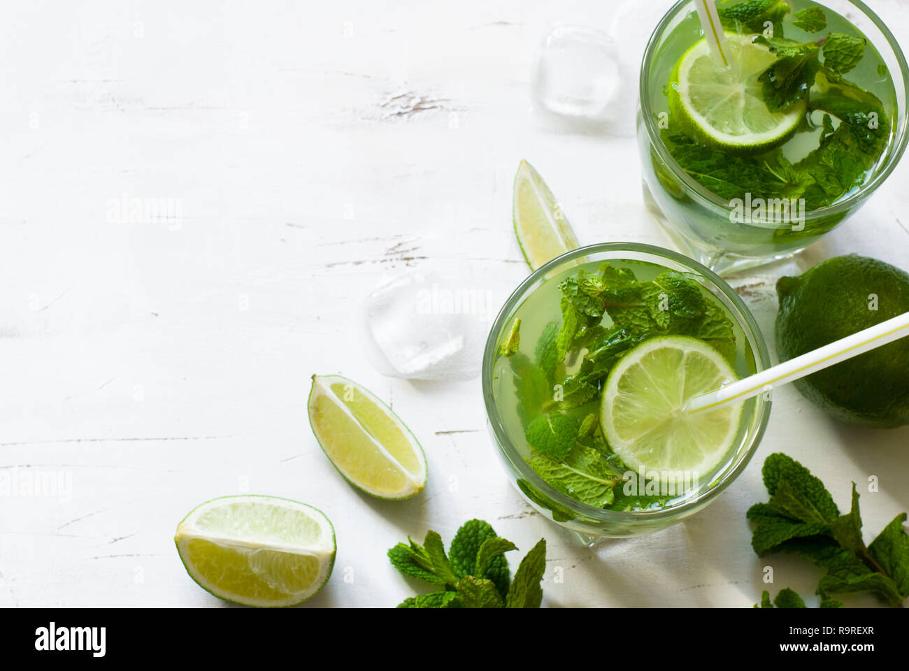 Tradition Summer drink mojito with lime and mint. Top view with copy ...