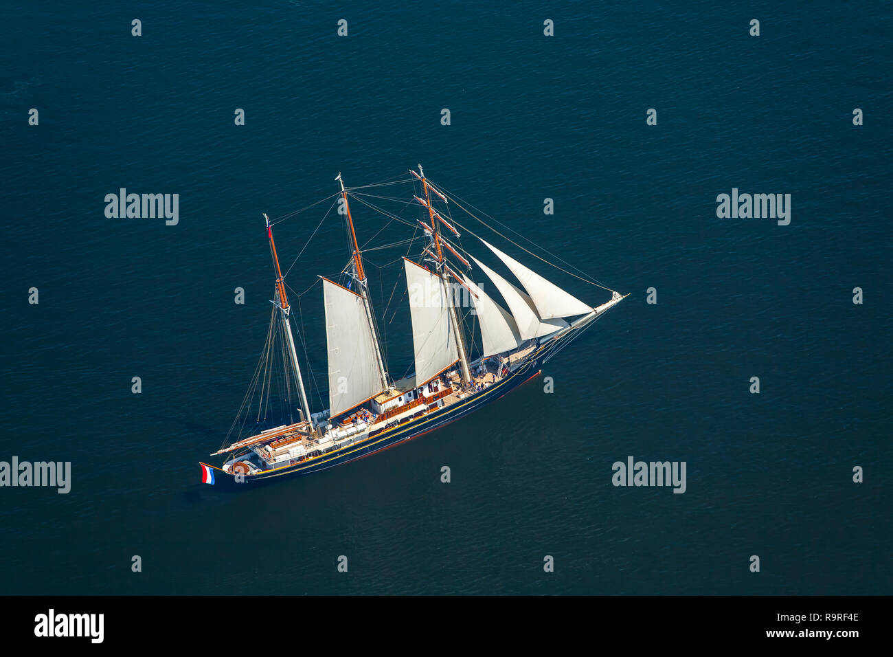 Aerial picture, large sailboat goes to sea under sail. View from above ...