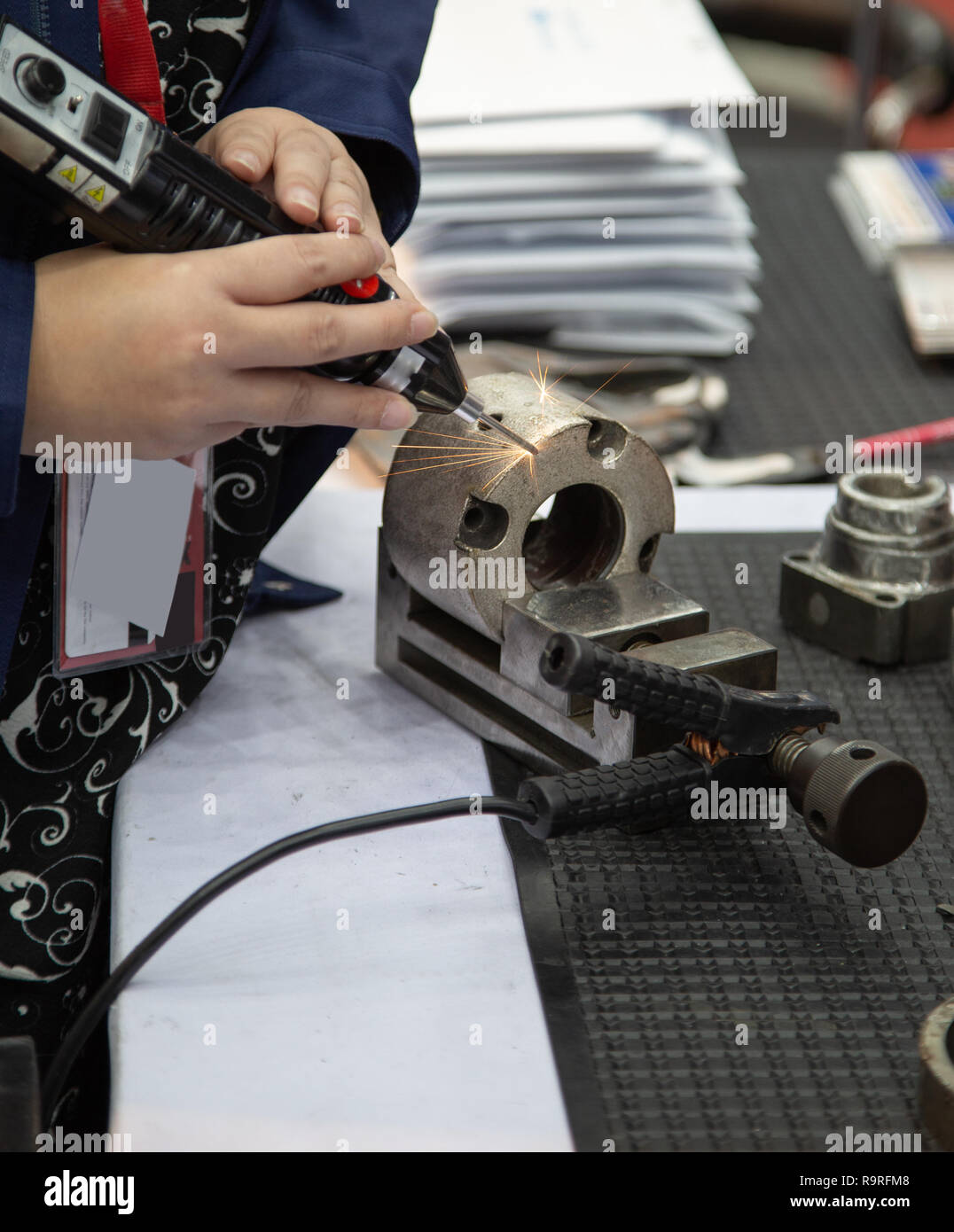 Worker operate Electro-Spark laser overlay / coating device Stock Photo ...