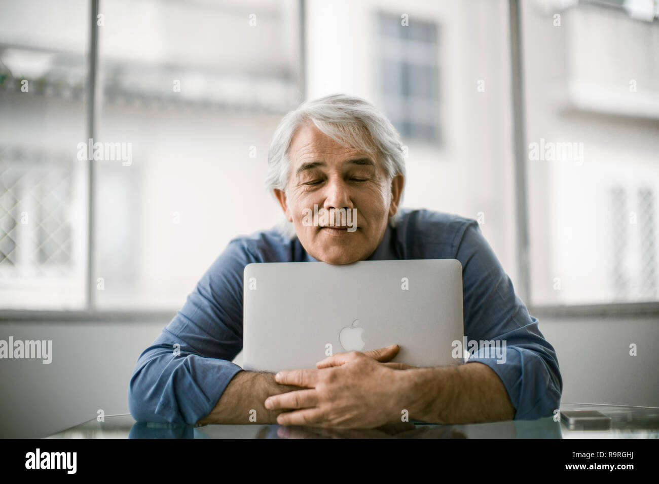 Businessman sitting around boardroom table hi-res stock photography and ...