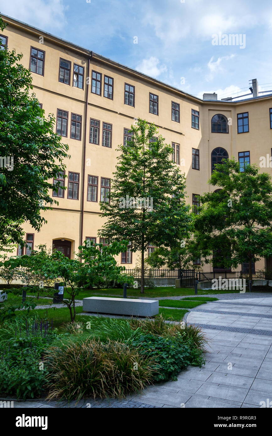 Public park between modern office buildings, future of work, coworking ...