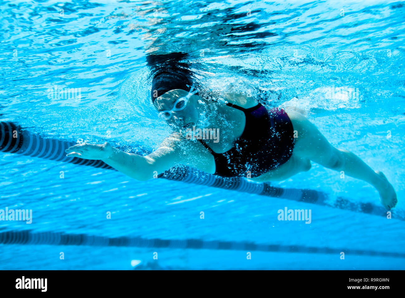 Female swimmer swimming the front crawl Stock Photo - Alamy