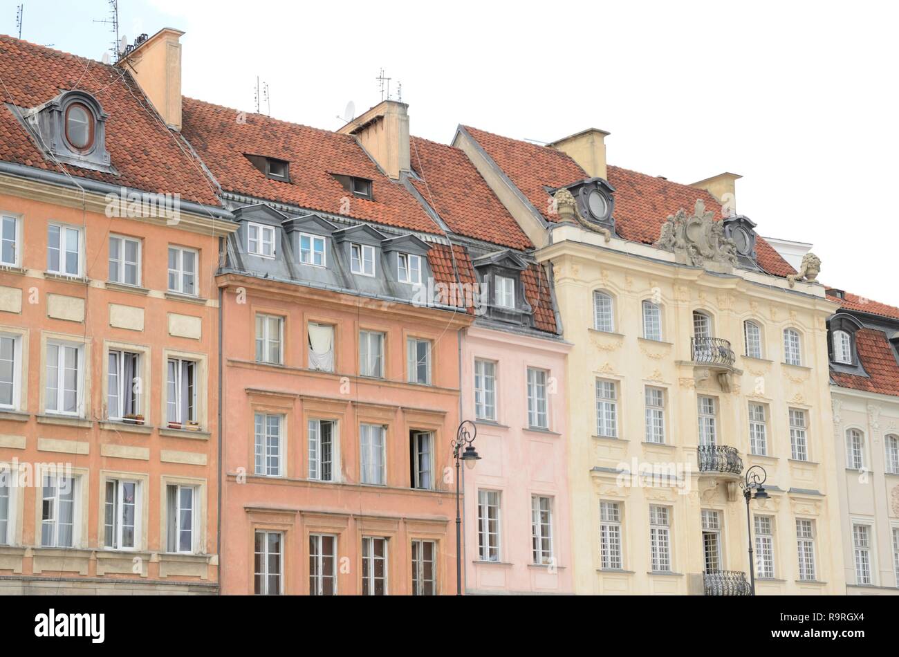 Row of color facades at the Castle Square in Warsaw, Poland Stock Photo ...