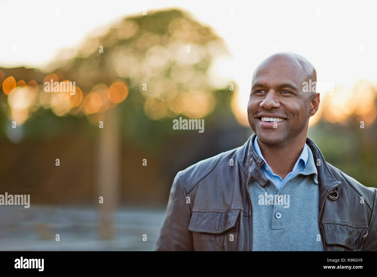 Man in leather jacket stands hi-res stock photography and images - Alamy