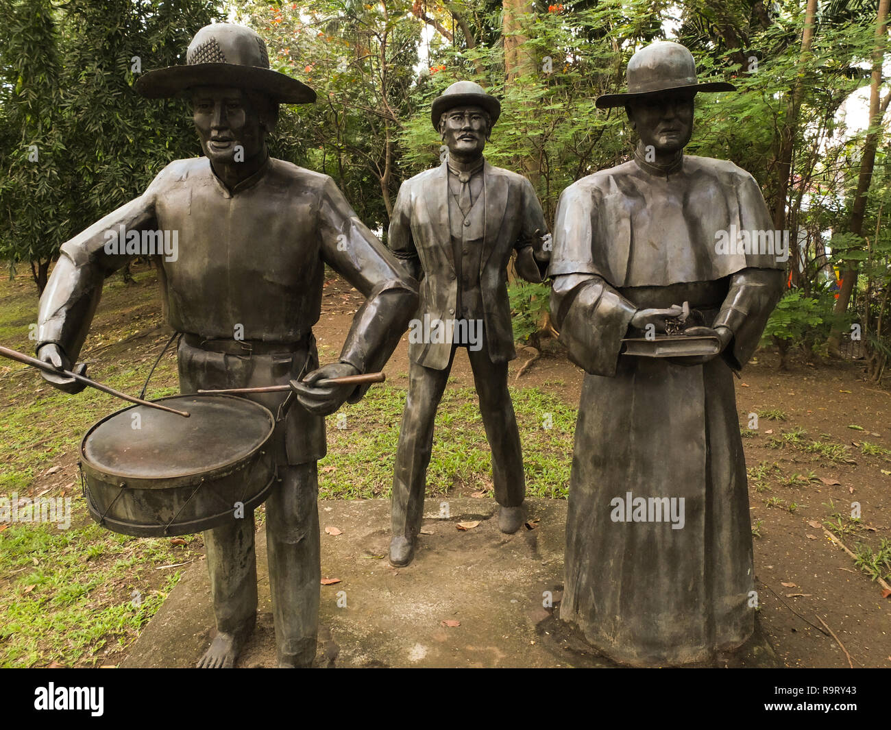 Bronze statues of Spanish soldier with drums, a friar and an arm-tied ...