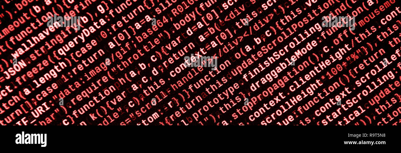 Writing programming code on laptop. Digital binary data on computer screen. Project managers ...
