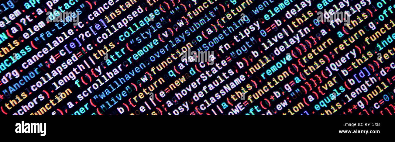 Writing programming code on laptop. Digital binary data on computer screen. Project managers ...