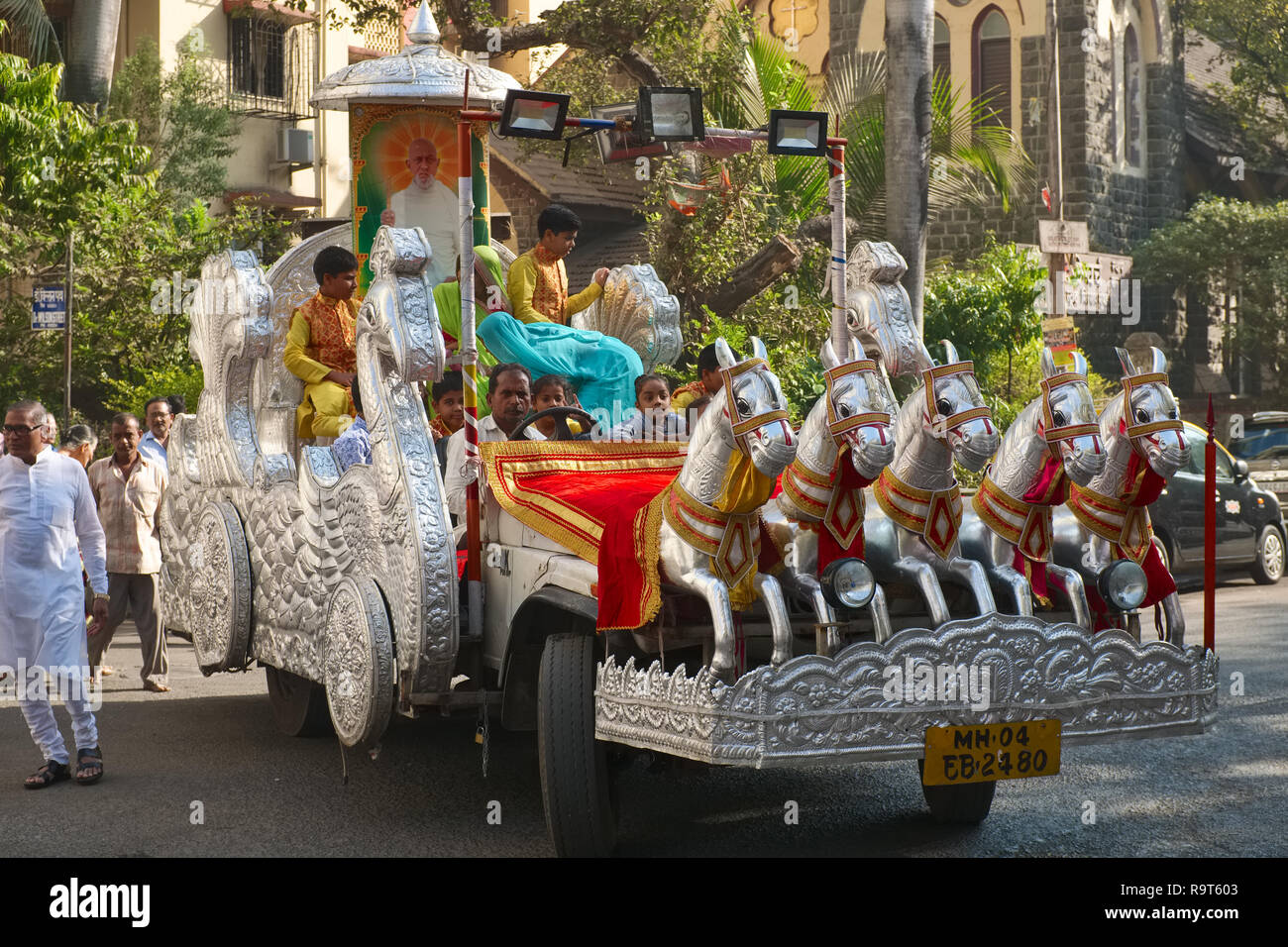 In the course of a Jain festival in Mumbai, India, a chariot fronted by ...