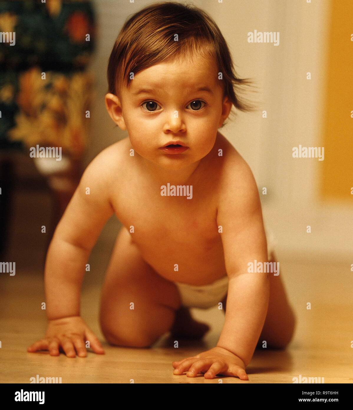 Crawling baby in diapers hi-res stock photography and images - Alamy