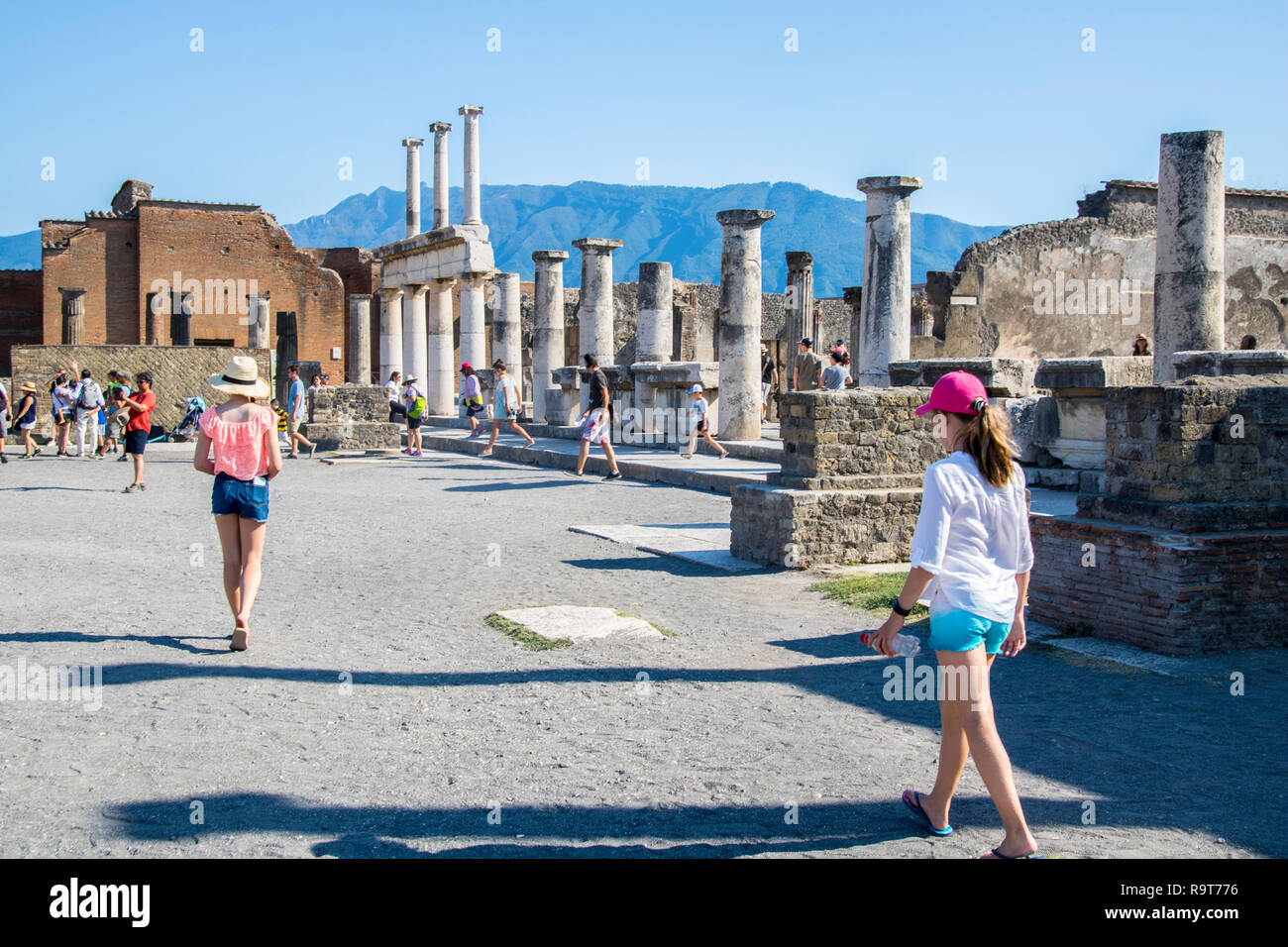 Tourists visiting Roman Forum, Colonnade, Pompeii, Campania Italy ...
