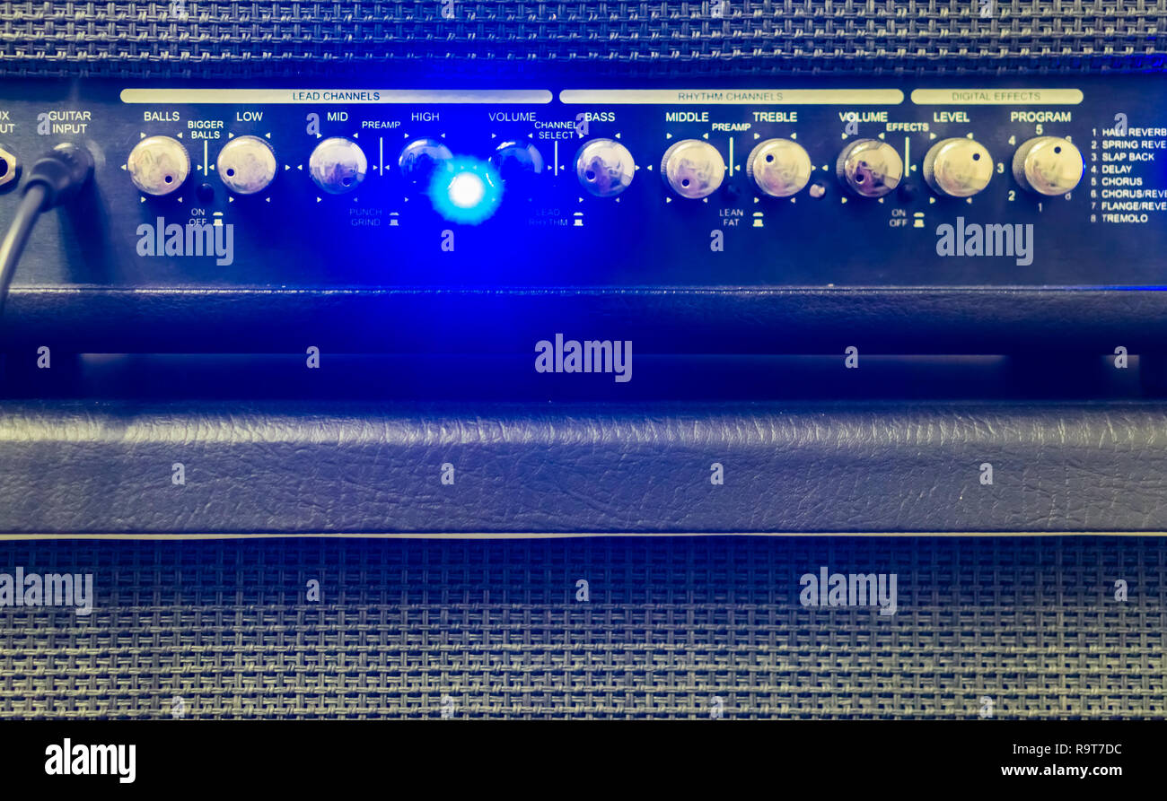 guitar cable plugged into the amplifier box, professional music ...