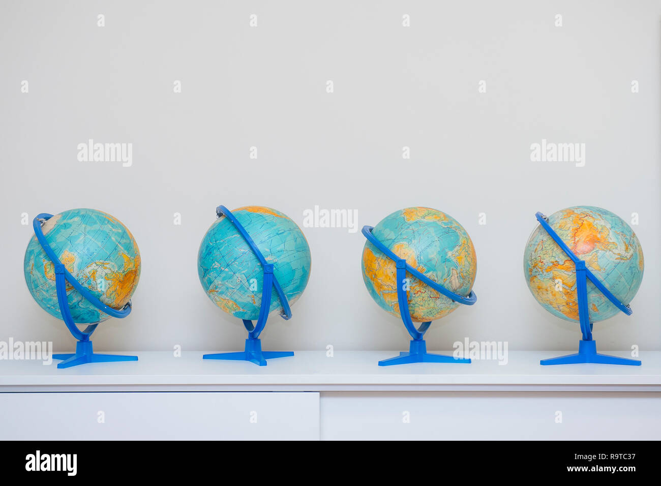 Globes models on desk ,isolate white background Stock Photo - Alamy
