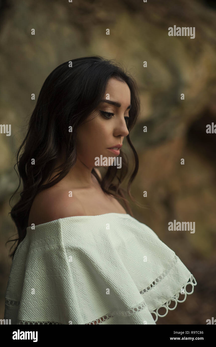 Side view portrait of a sad young woman outdoors Stock Photo - Alamy
