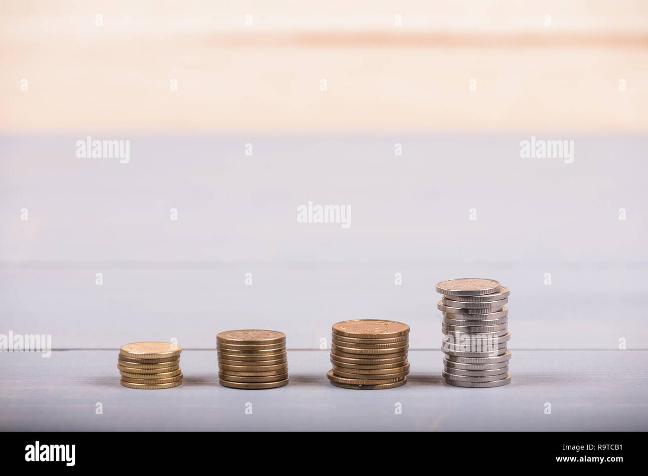 Money change coins stacks natural grey light white wooden background ...