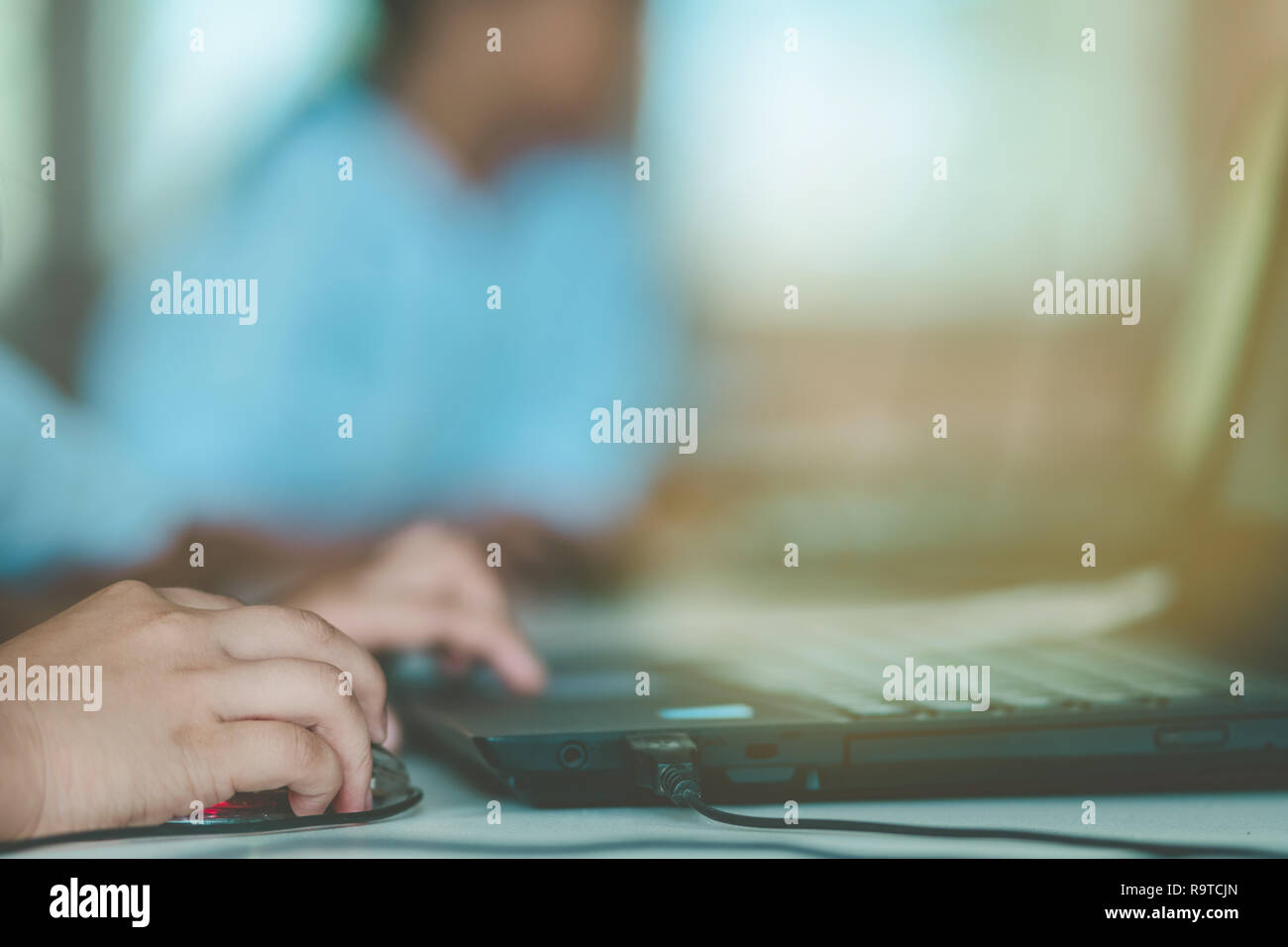 Close up to Student hands practice drawing art by computer in classroom ...