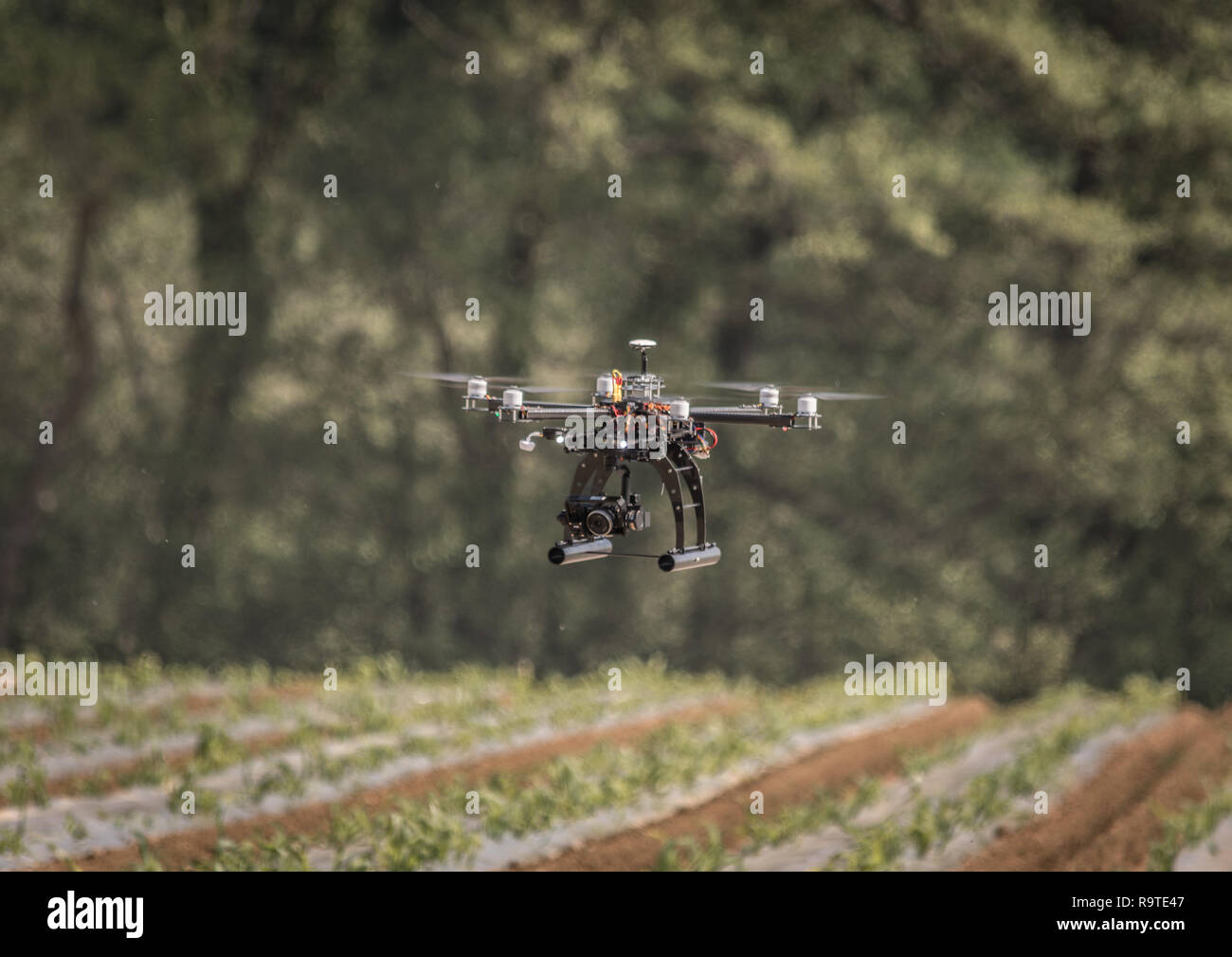 Hexacopter flying oer agricultural land hi-res stock photography and ...