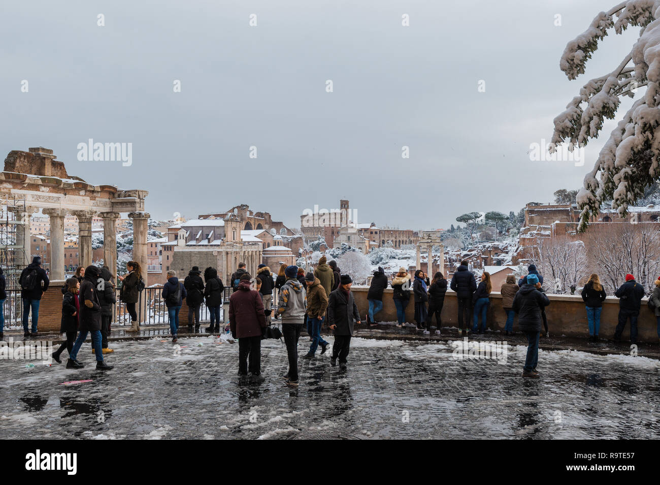Winter in Rome. Tourists admire the wonderful and rare view of Roman ...