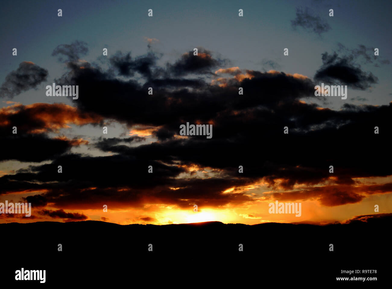 sunset over butte mt Stock Photo - Alamy