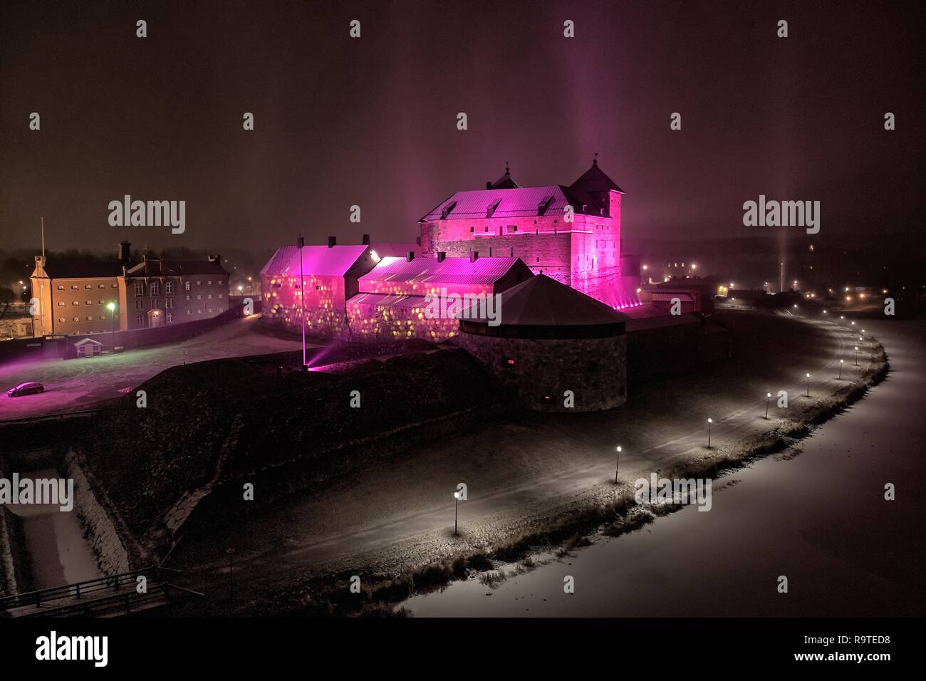 Medieval castle exterior night scene during light festival. Surreal ...