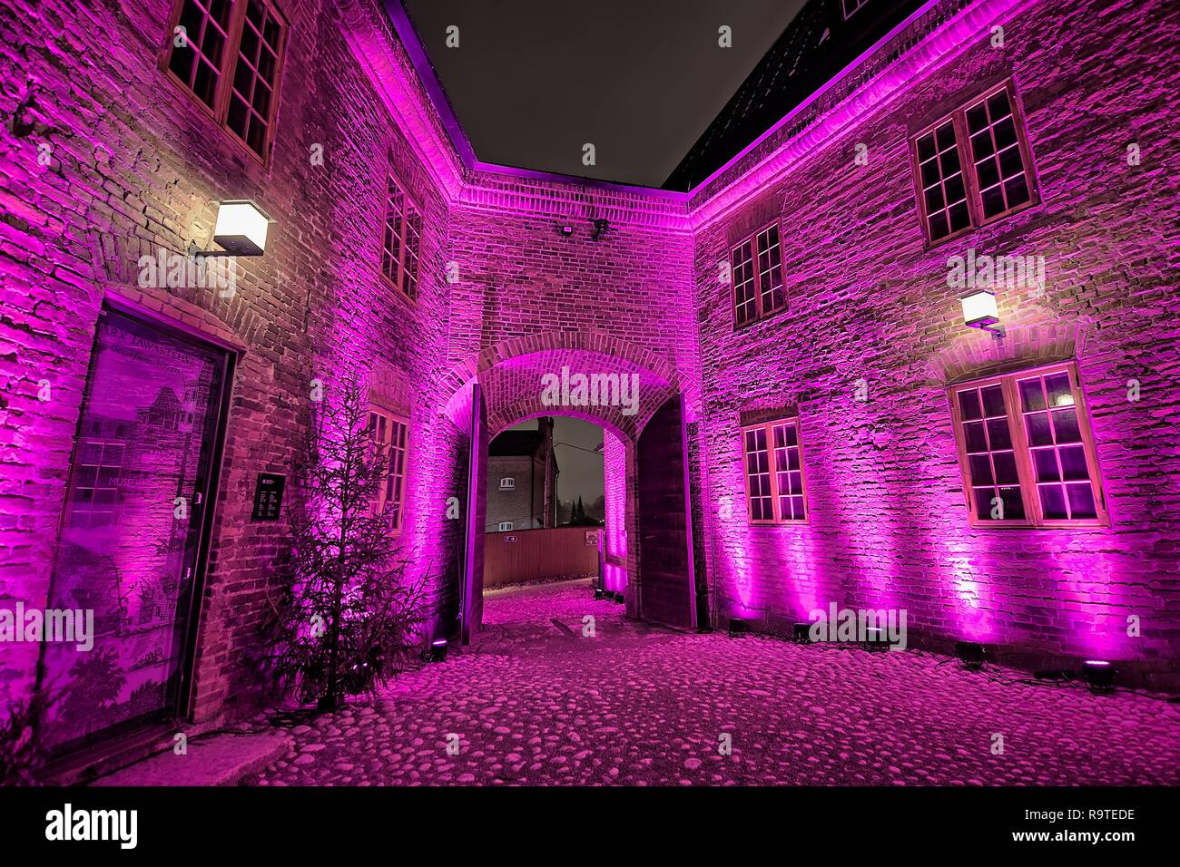 Medieval castle exterior night scene during light festival. Surreal ...