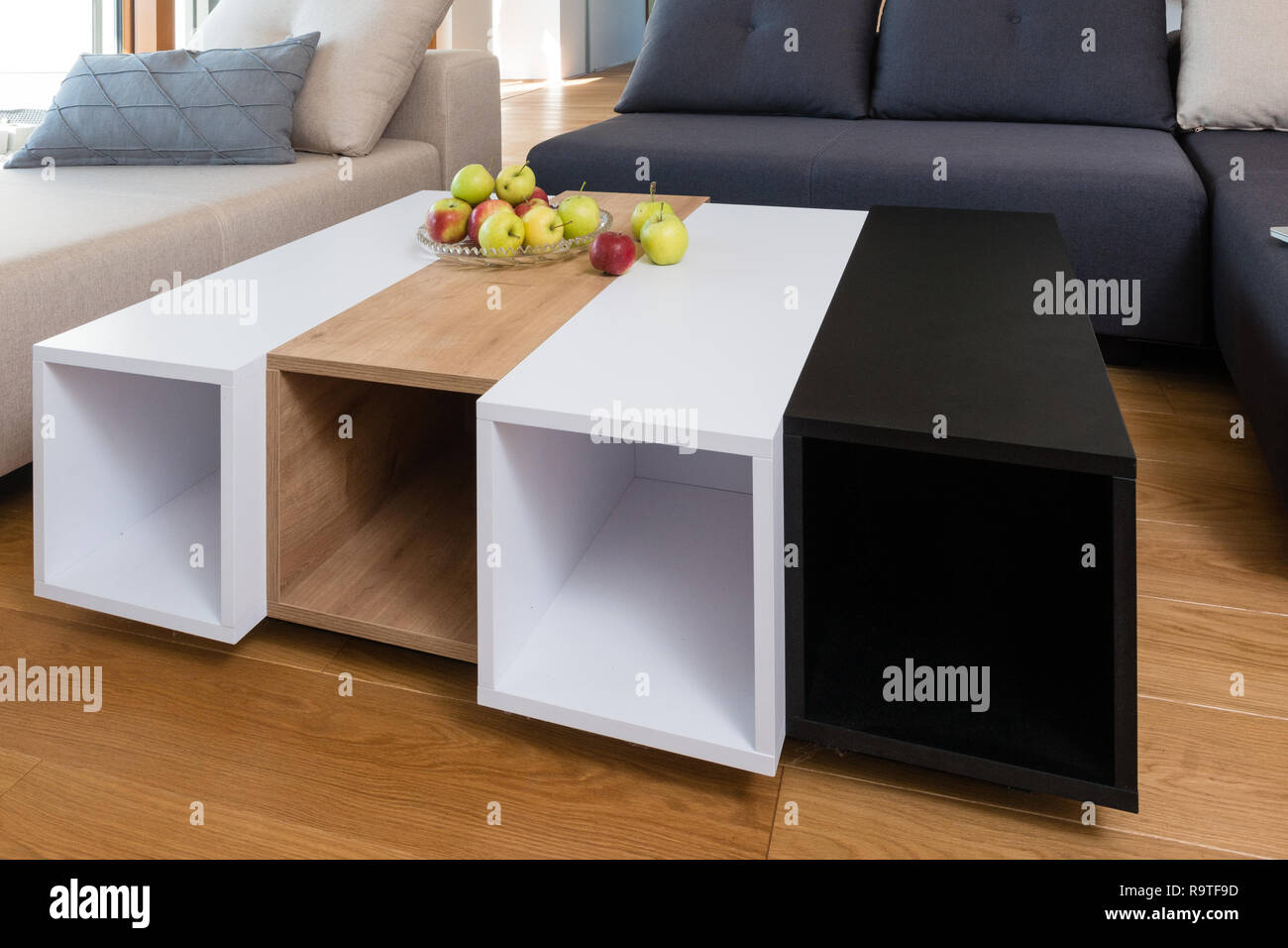 Custom table in modern living room Stock Photo - Alamy
